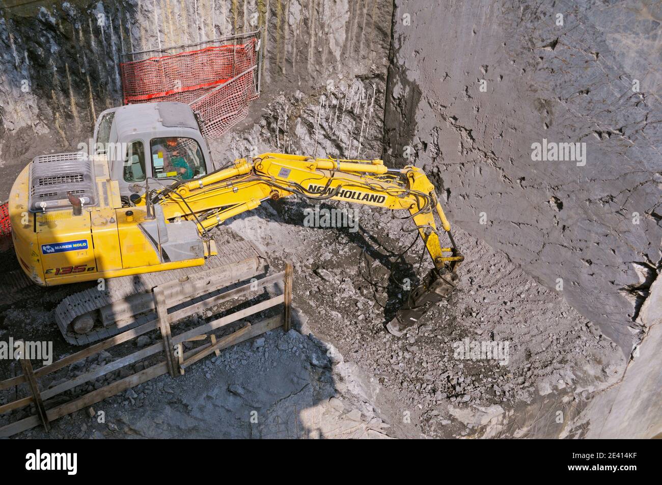 excavator with breaker hammer in housing building site Stock Photo - Alamy
