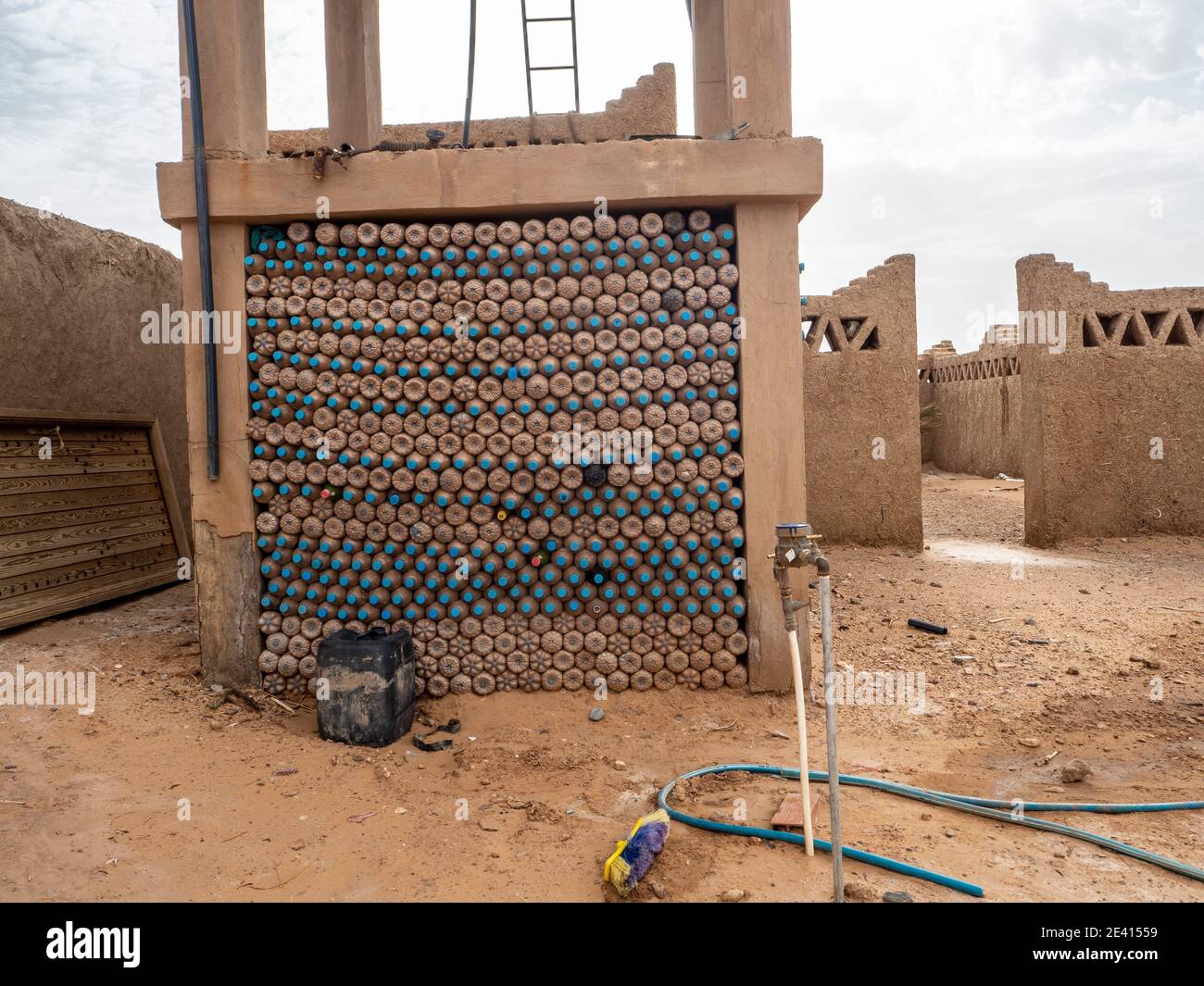 Reuse of plastic water containers for wall construction in the Sahara ...