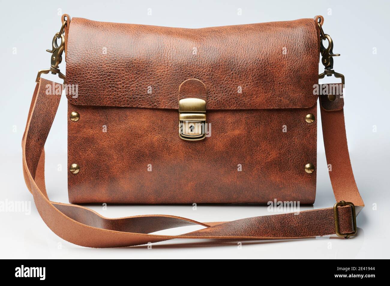 Brown leather bag with buckle front view isolated on white studio ...