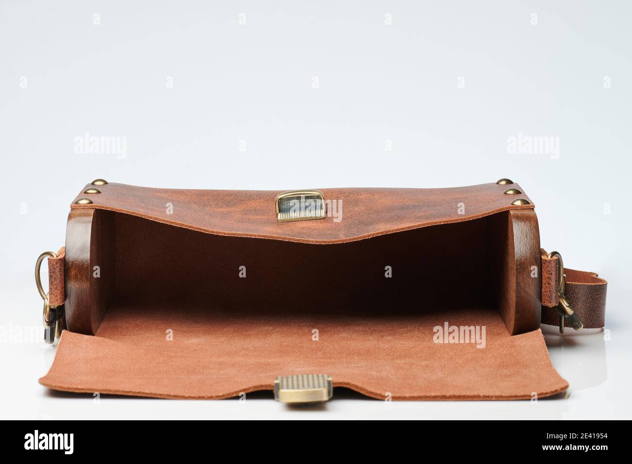Inside of open brown leather bag isolated on white studio background ...