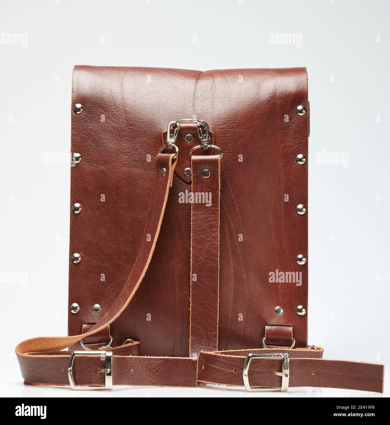 Brown leather backpack back view isolated on white studio background ...