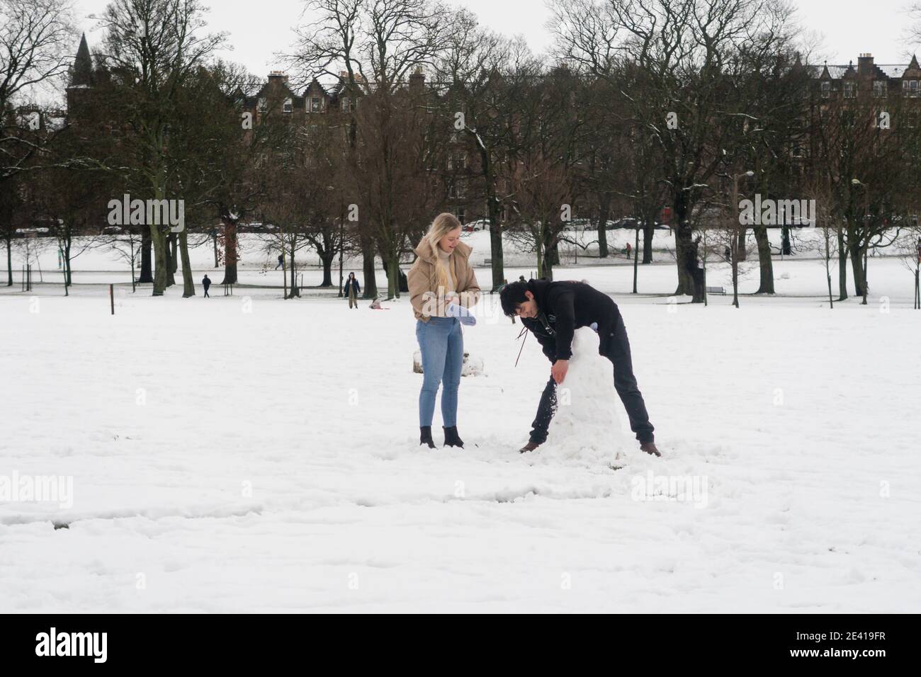 People building snowmen at the Edinburgh meadows in the capital city ...