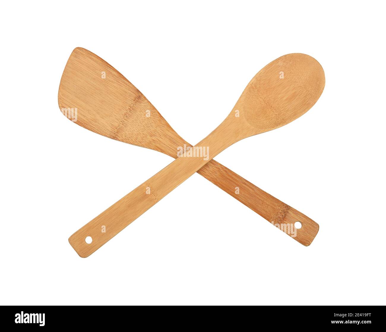 Close up one wooden spatula and one spoon crossed, natural cooking ...