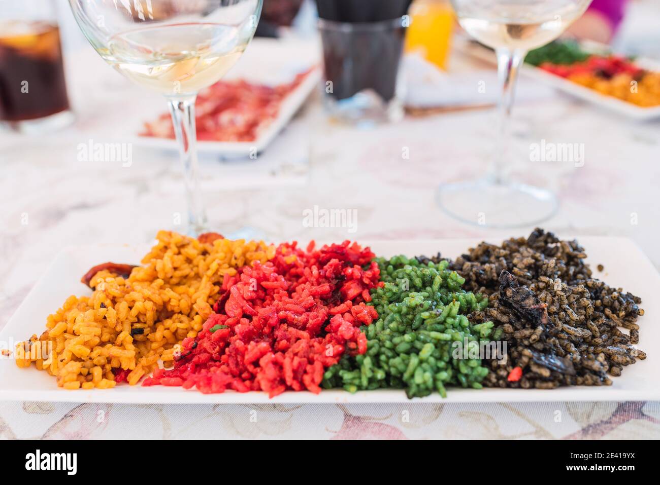 Tasting plate with various types of typical Valencian rice paellas ...