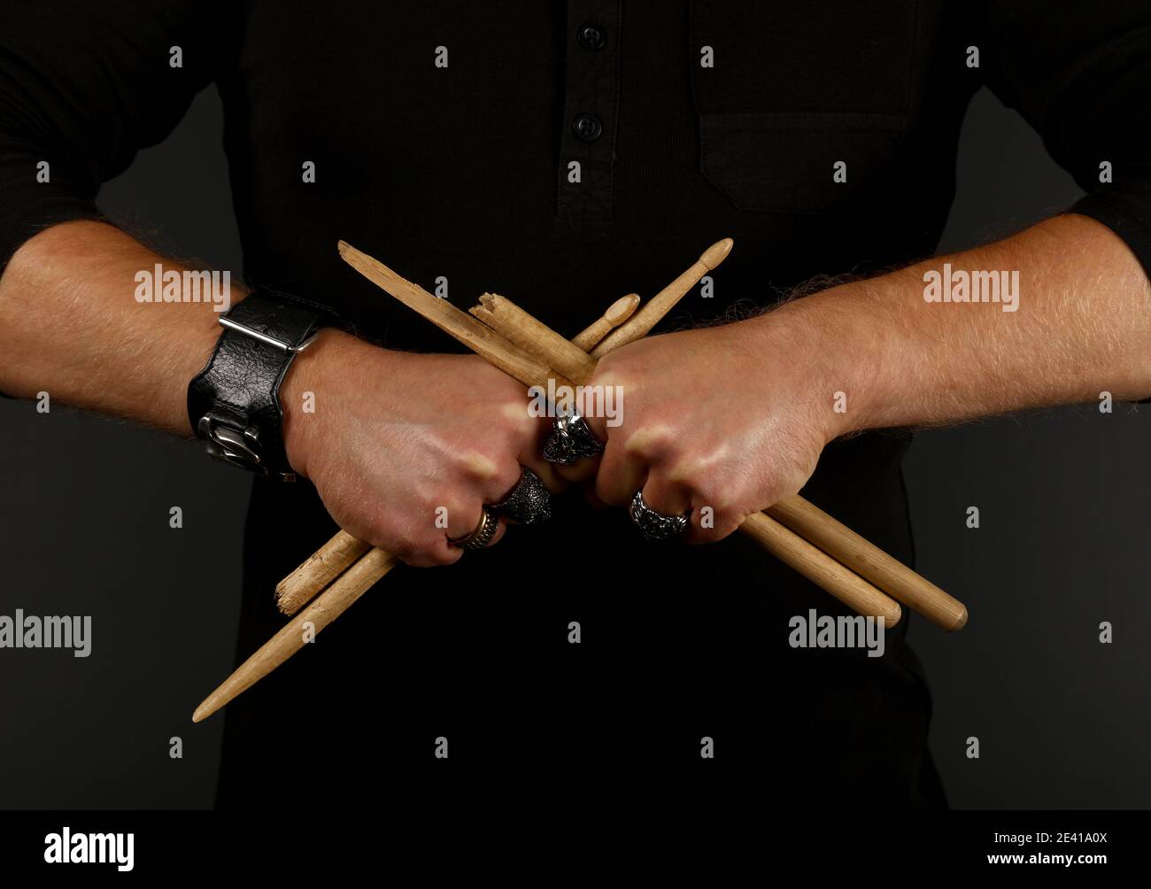 Crossed Black Drumsticks