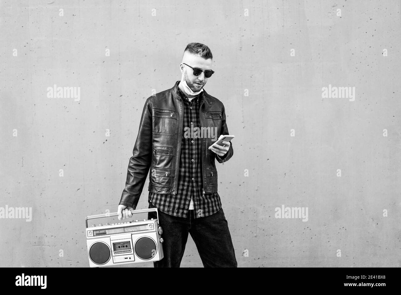 Handsome millennial guy using Black and White Stock Photos & Images - Alamy