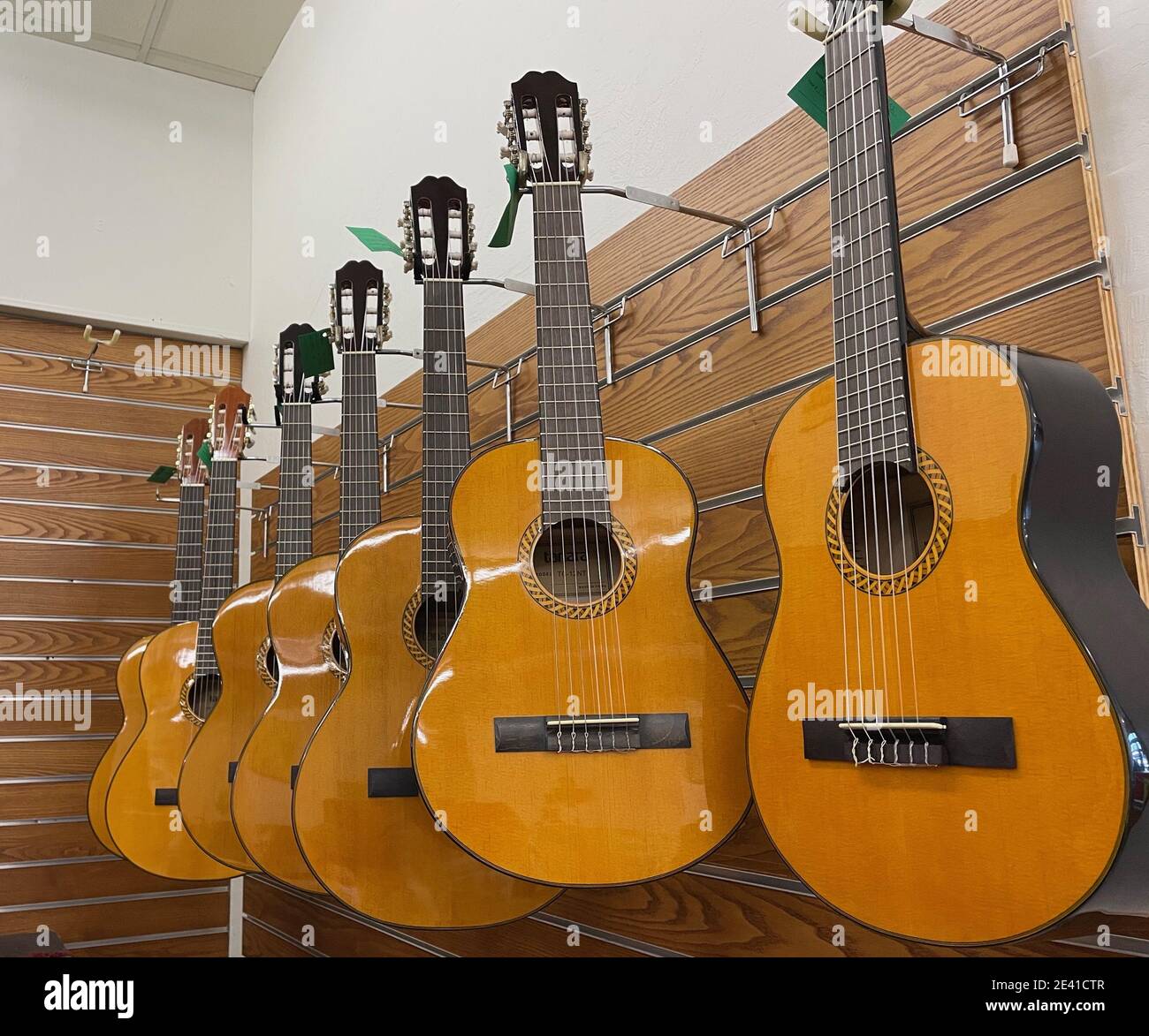 Row acoustic electric guitars hi-res stock photography and images - Alamy