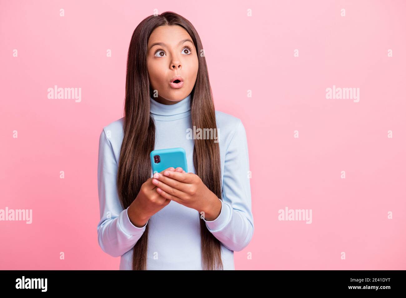 Portrait of pretty worried stunned girl using gadget thinking pout lips ...
