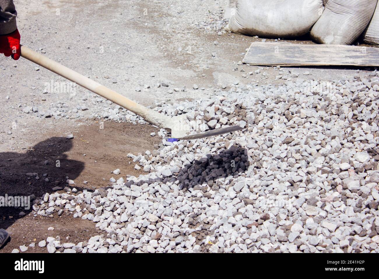 construction sites workers digging sand with shovels Stock Photo - Alamy