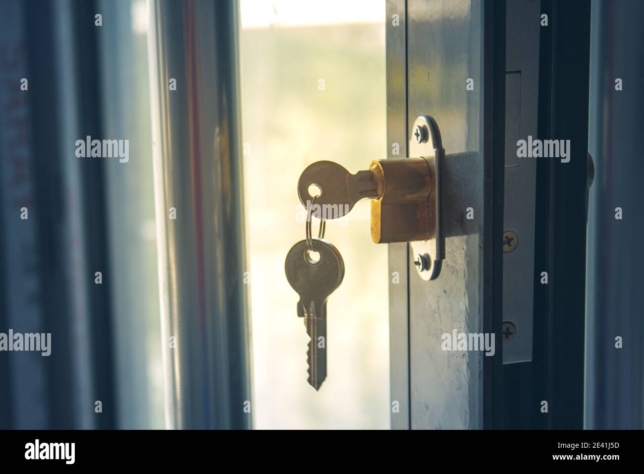 New keys are inserted into the door lock Stock Photo - Alamy