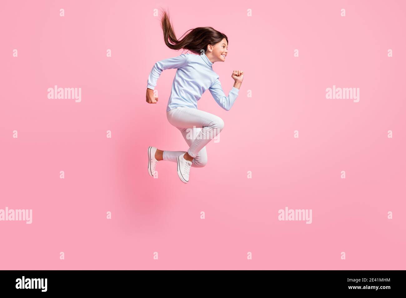 Full length body size view of pretty motivated cheerful girl jumping ...