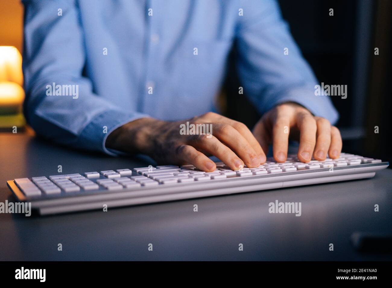 Hands and computer and dark room hi-res stock photography and images ...