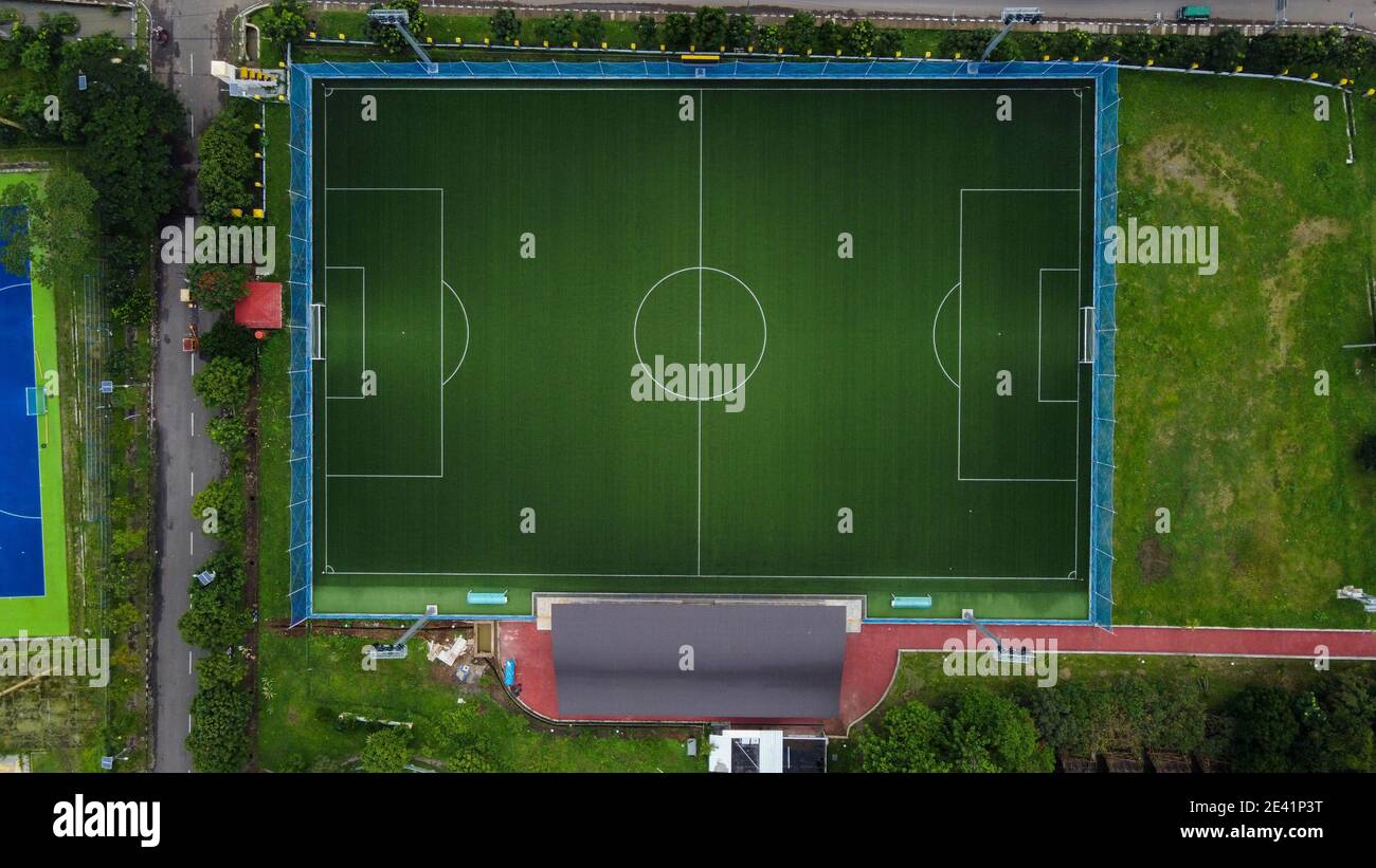 aerial shot of big modern stadium. Top view at the stadium with green ...