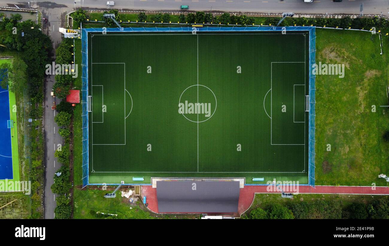 aerial shot of big modern stadium. Top view at the stadium with green ...