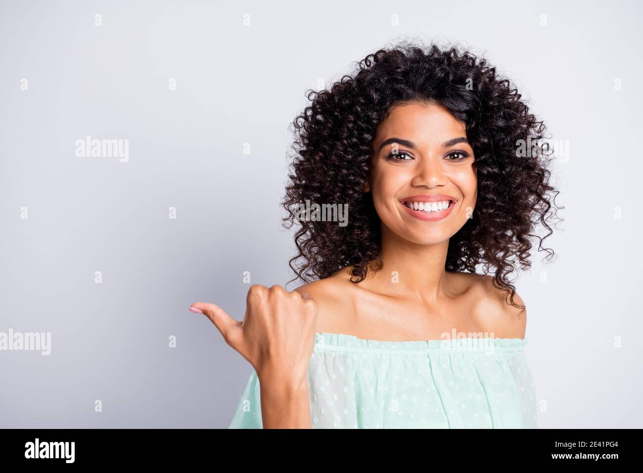 Pointing behind with her thumb hi-res stock photography and images - Alamy