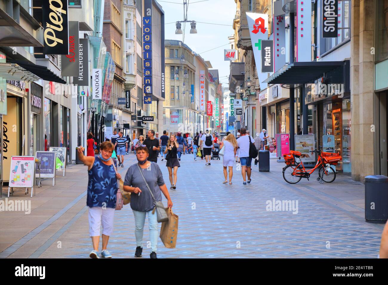 DORTMUND, GERMANY - SEPTEMBER 16, 2020: People walk a shopping street ...