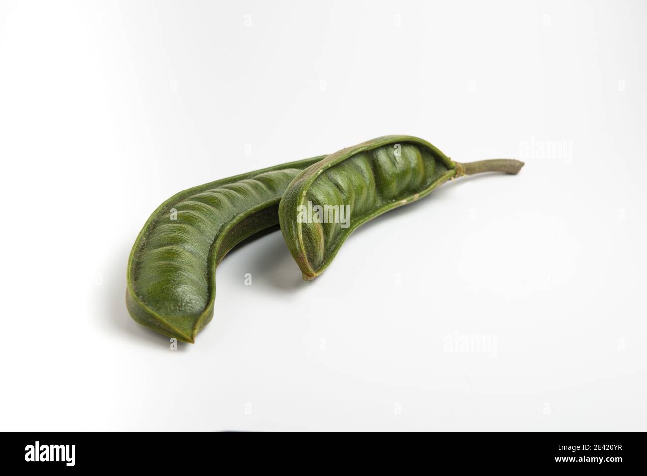 Isolated closeup of guaba pods on white background Stock Photo - Alamy
