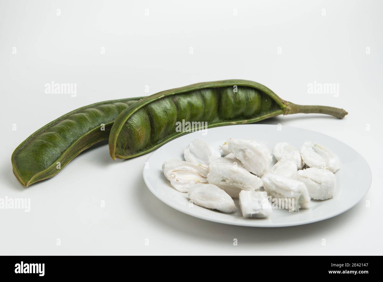 Isolated closeup of guaba pods and seeds on white background Stock ...