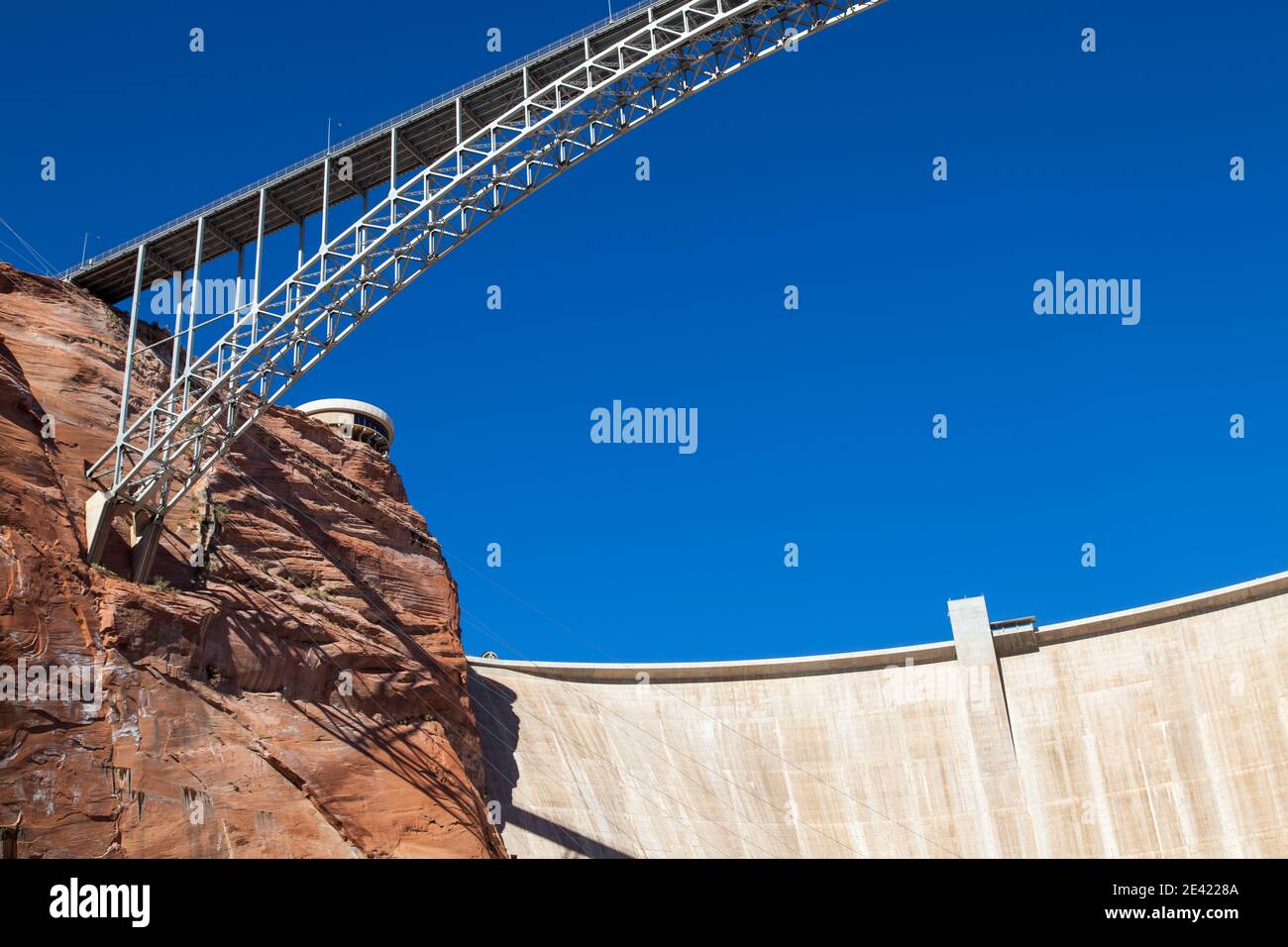 The circular Carl Hayden Visitor Center sits on red sandstone cliffs ...