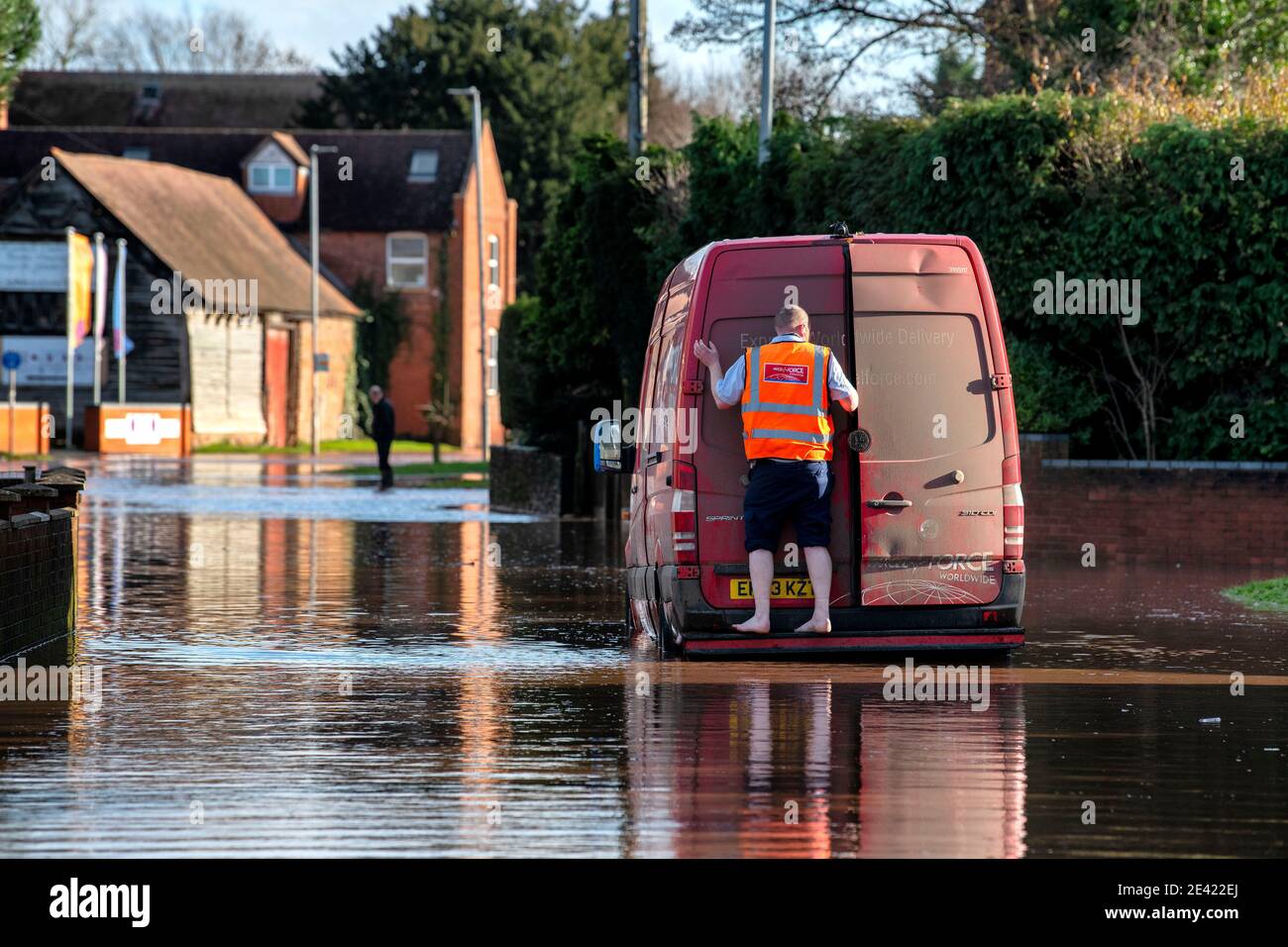A Parcelforce delivery van is stranded in flood water in Hereford as ...