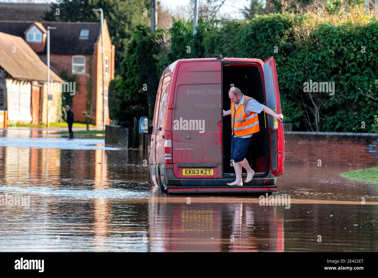 A Parcelforce delivery van is stranded in flood water in Hereford as ...
