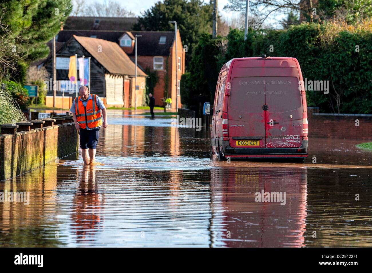 A Parcelforce delivery van is stranded in flood water in Hereford as ...