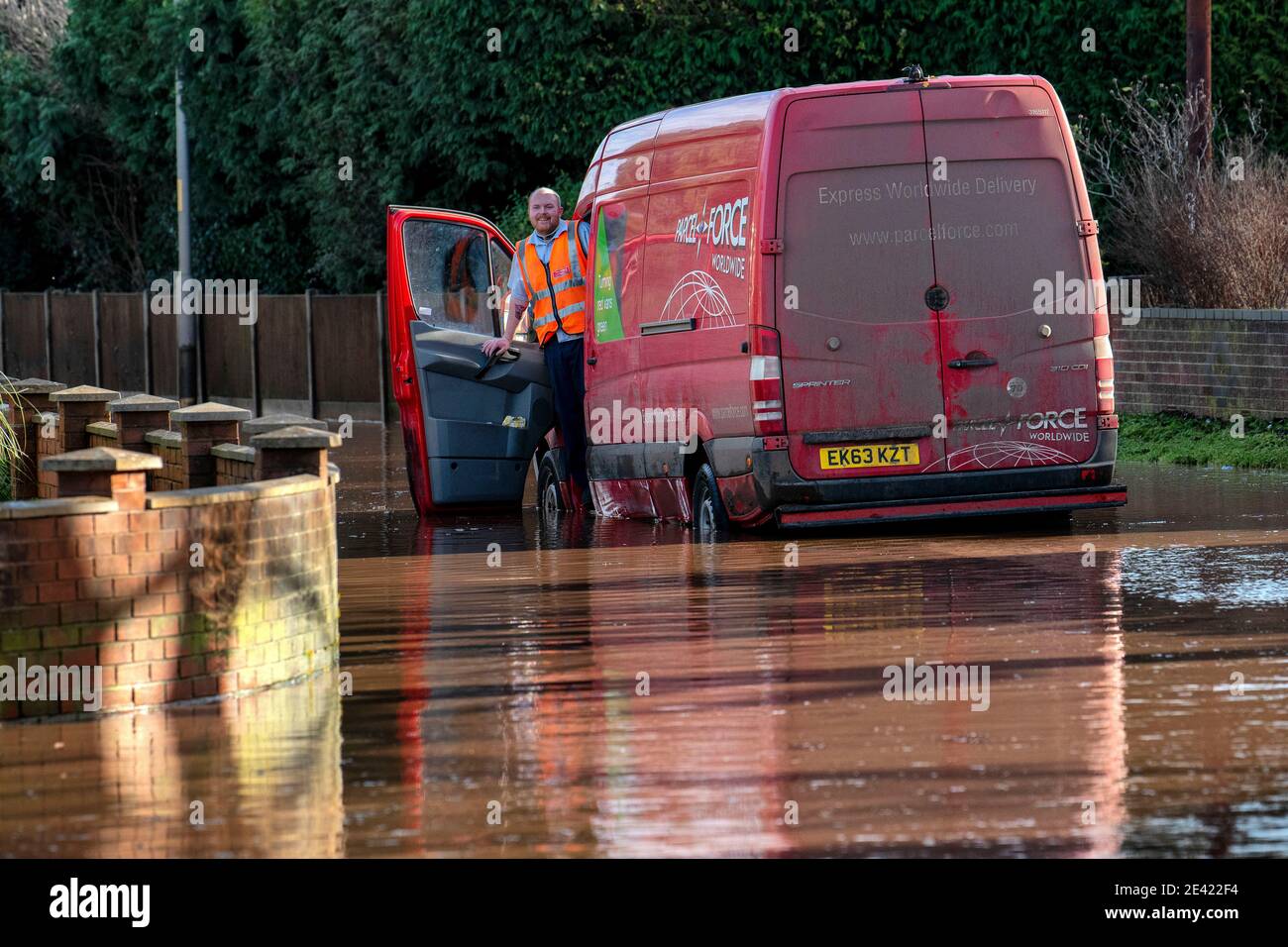A Parcelforce delivery van is stranded in flood water in Hereford as ...