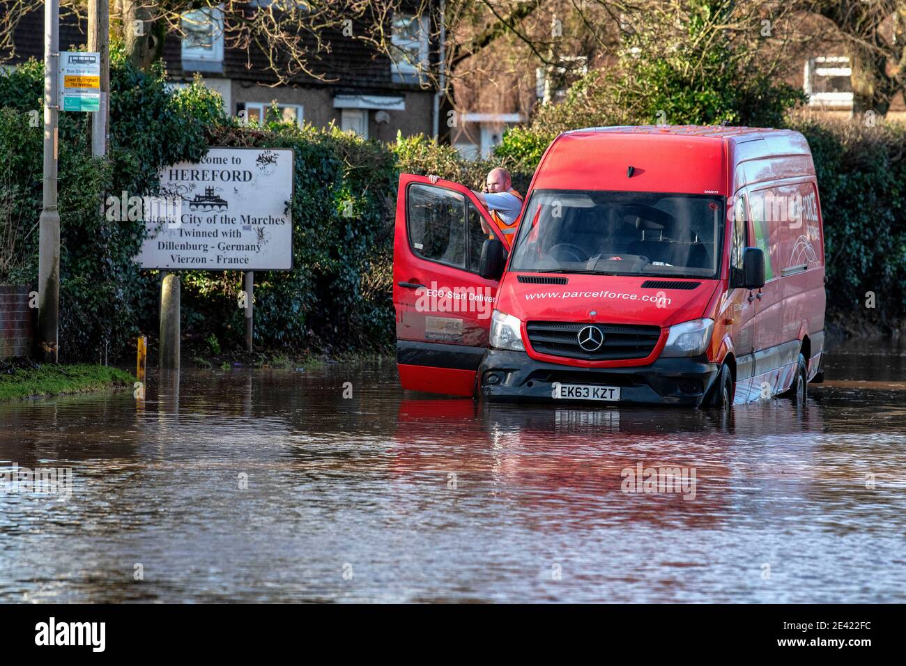A Parcelforce delivery van is stranded in flood water in Hereford as ...
