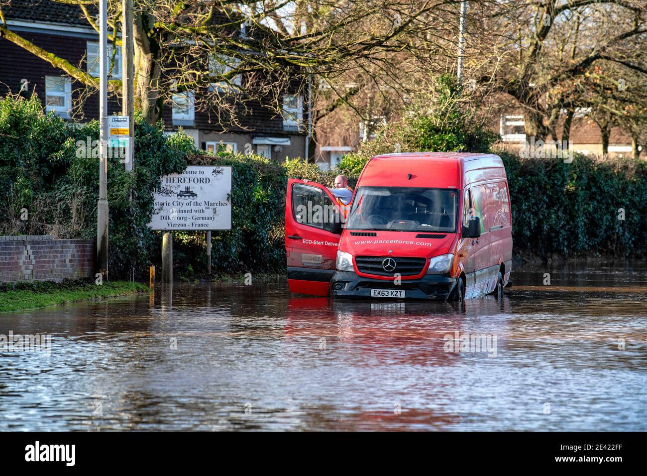 A Parcelforce delivery van is stranded in flood water in Hereford as ...