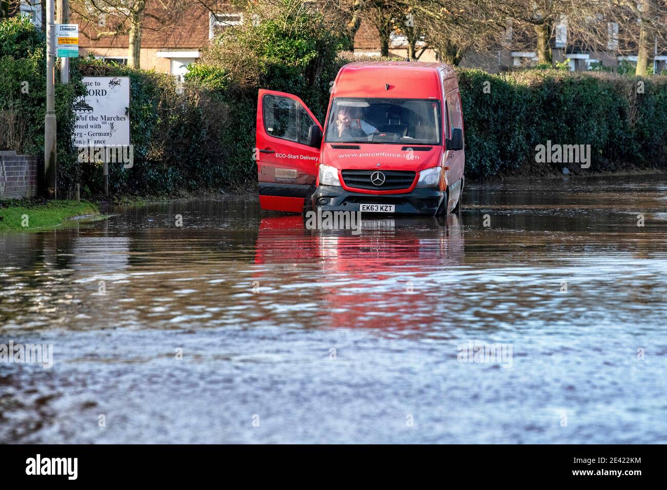 A Parcelforce delivery van is stranded in flood water in Hereford as ...