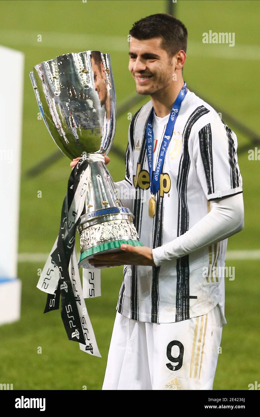 Juventus's Spanish striker Alvaro Morata exults with the cup in his ...