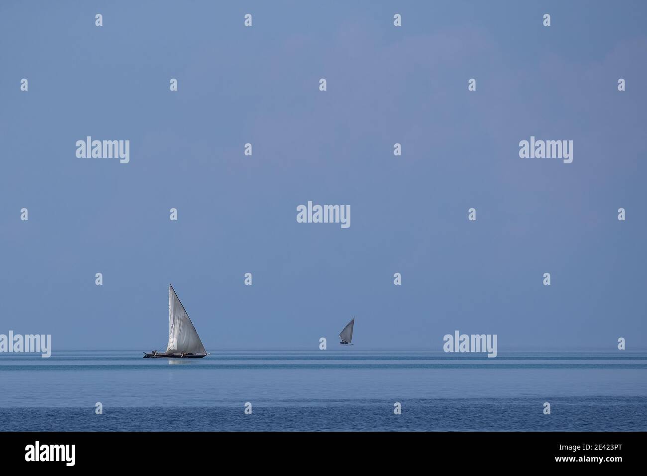 Two fishing boats on calm sea in Tanzania Stock Photo - Alamy