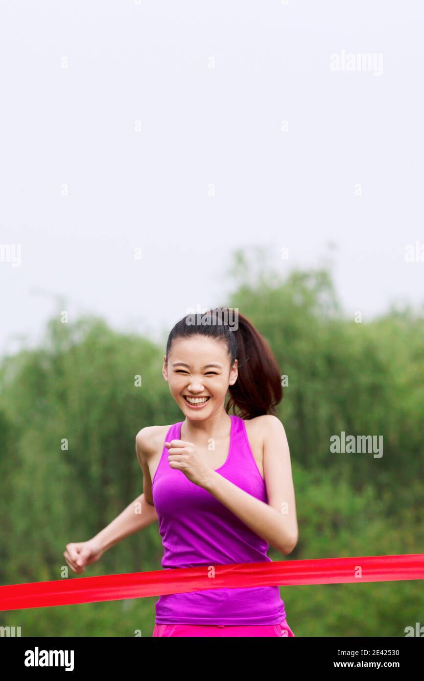 Young women to cross the finish line high quality photo Stock Photo - Alamy