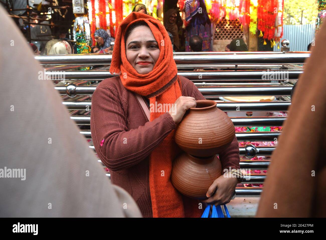 Pakistani women devotees bringing water for ablution of the graves at ...