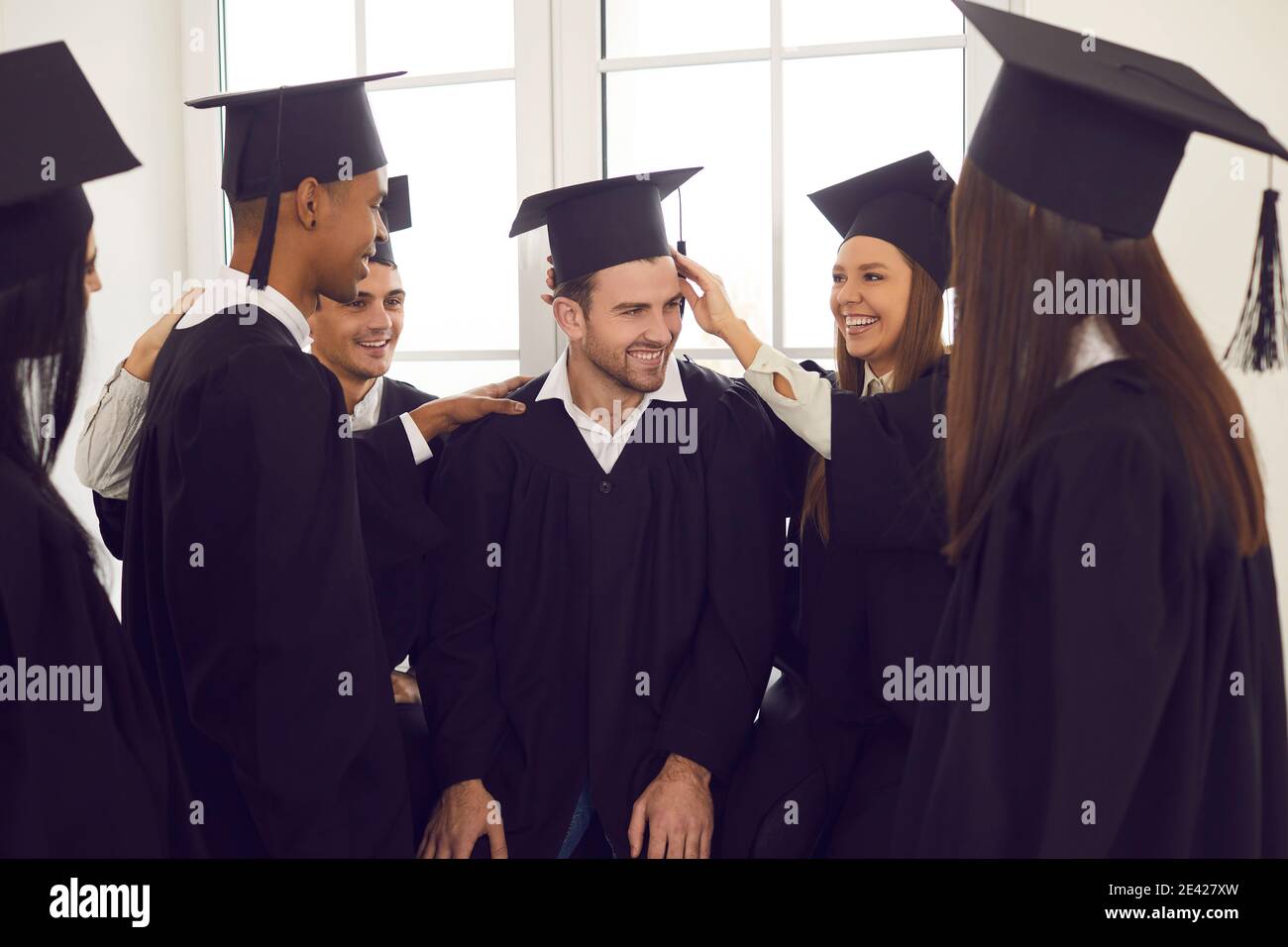 Male graduate of the university is happy and excited about the ...