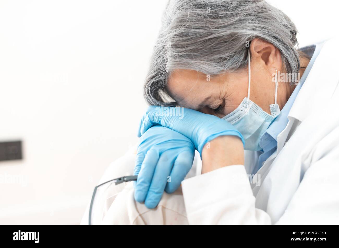 Resting head on knees hi-res stock photography and images - Alamy