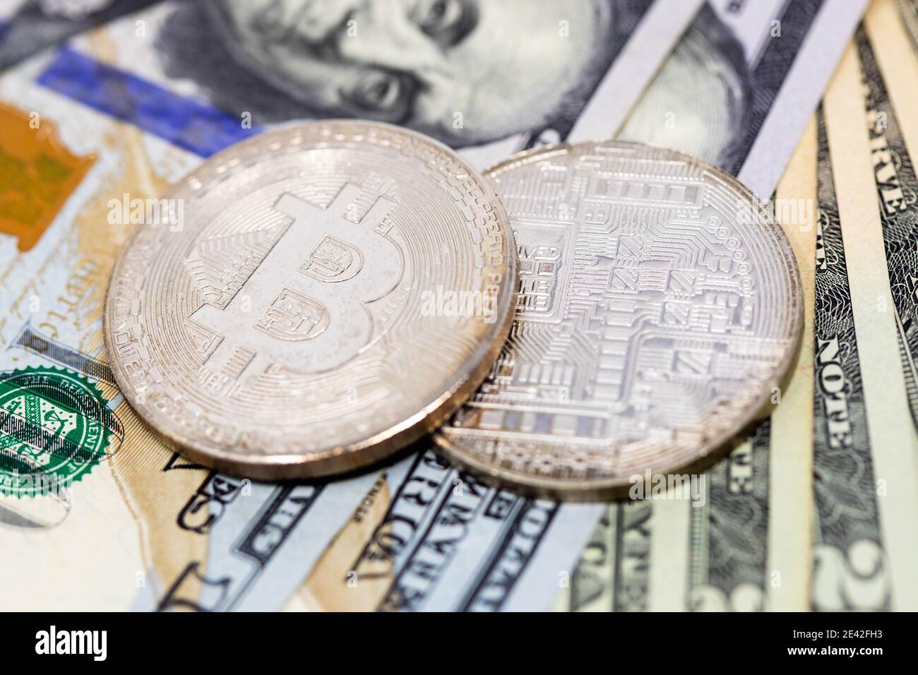 Bitcoin crypto currency on dollar notes close up new currency symbol ...