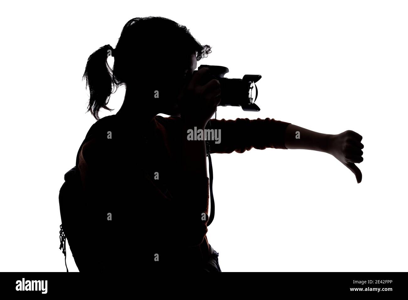 Silhouette of a photographer with a camera on a white background ...