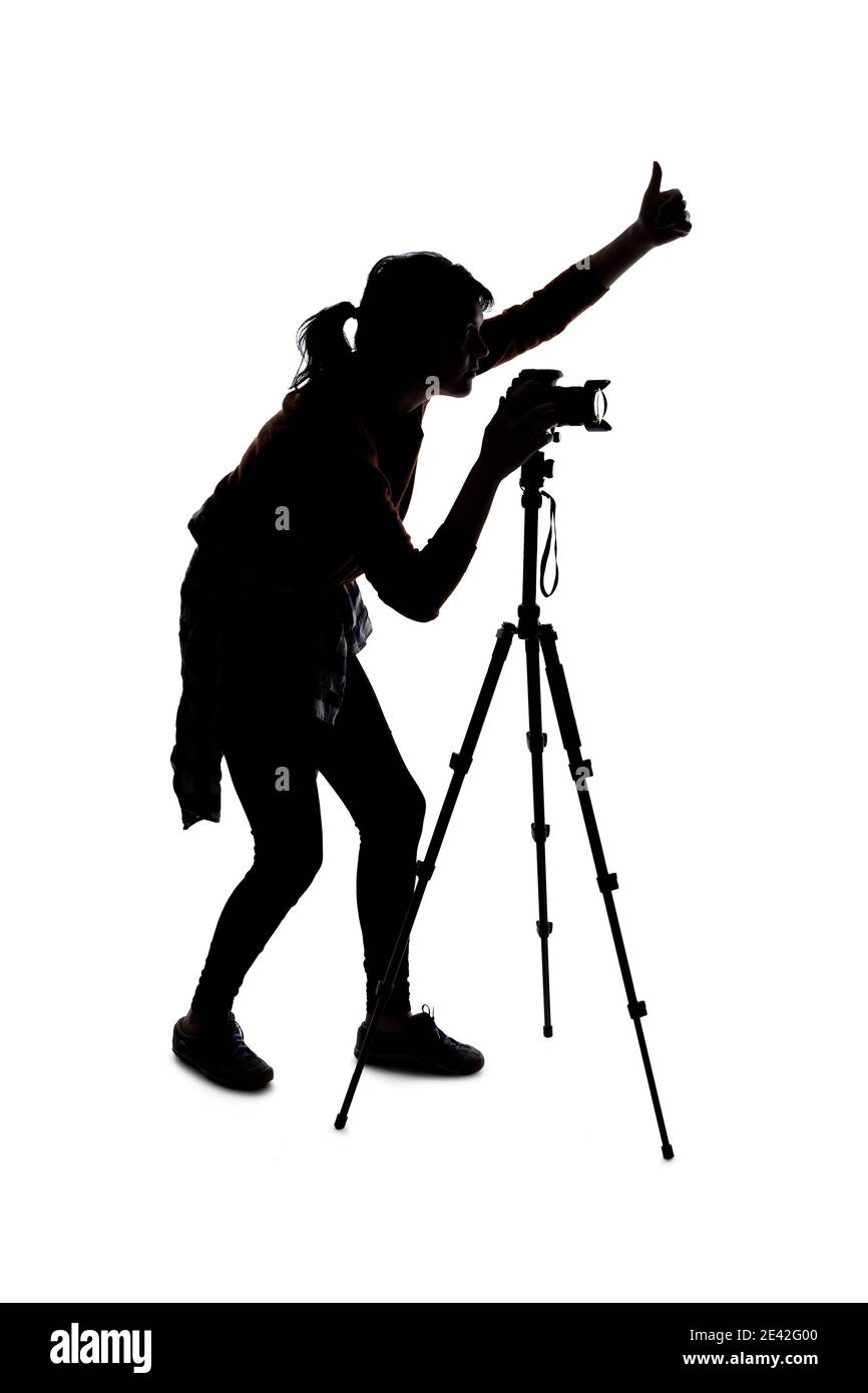 Silhouette of a photographer with a camera on a white background ...