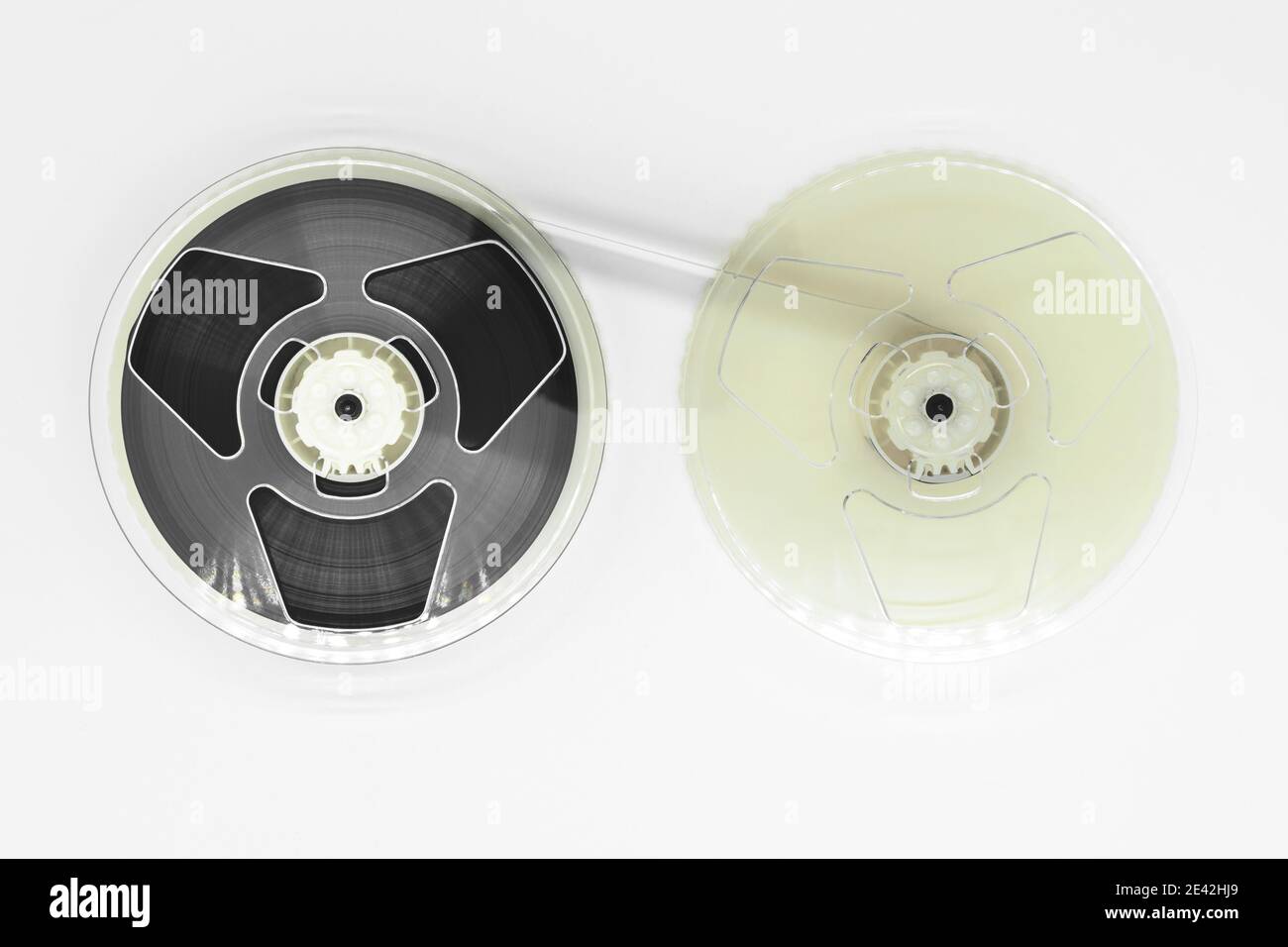 Abstract composition of video home system VHS tape reels on white ...