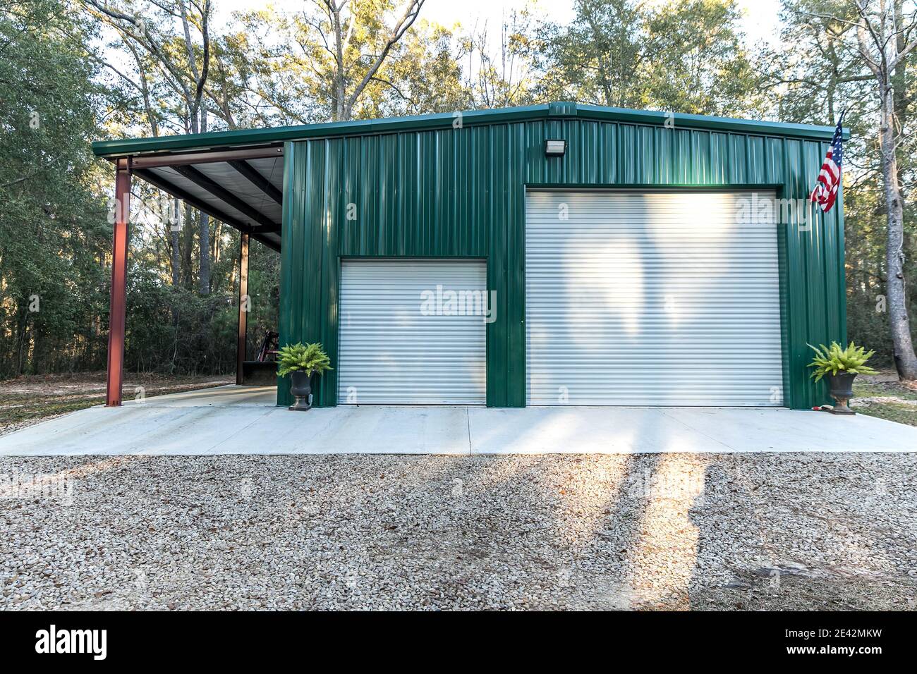 Large green outdoor metal building Stock Photo - Alamy
