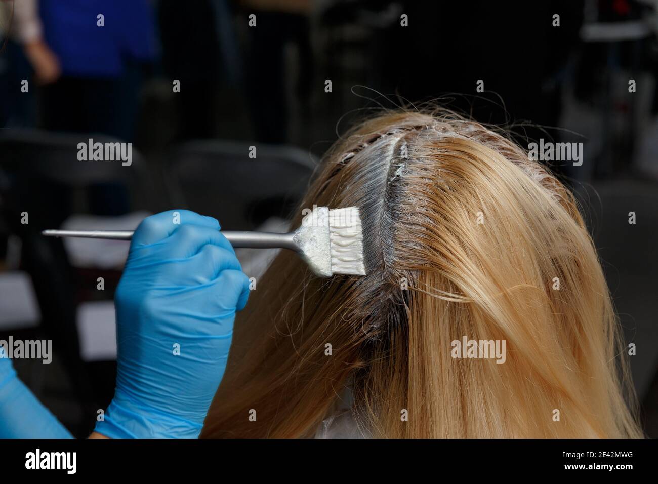 Hairdresser salon. Hair colouring in process. Woman dyeing hairs Stock ...