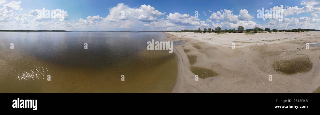 Photo from a flying drone, sandy beach by the sea on a sunny day in ...