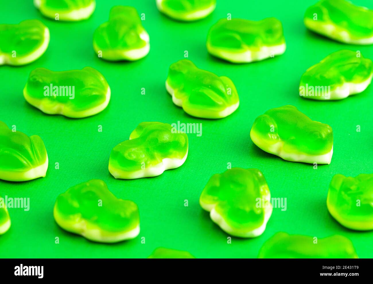 A Background of Gummy Green Frogs with a Mashmallow Candy Bottom Layer ...