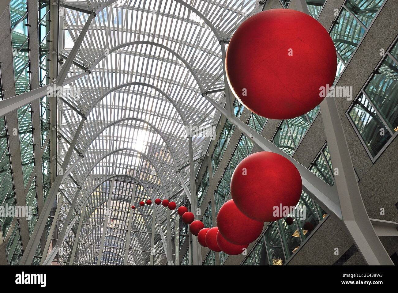 A group of red balls in displayed on the atrium of Brookfield Place ...