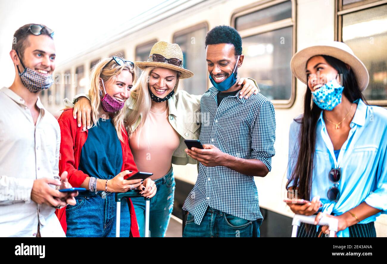 Friends group having fun with mobile smart phones while waiting for ...