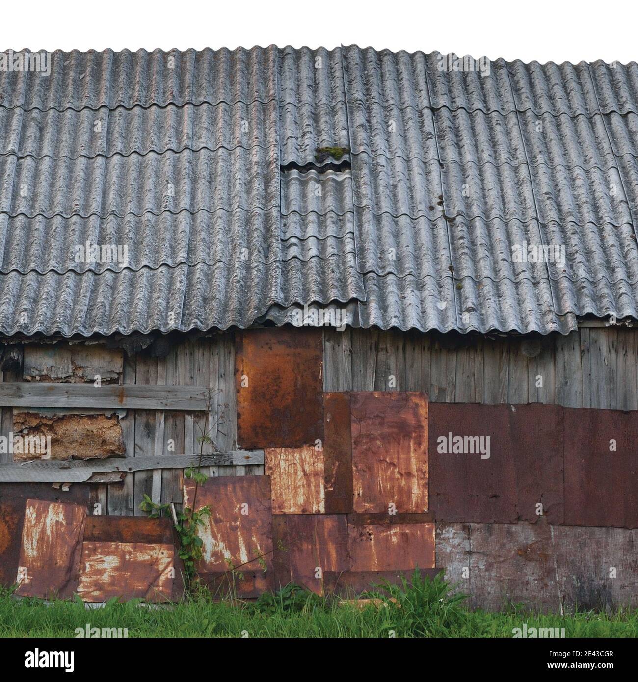 Old aged weathered wooden shack, grey plated wood boarding hut wall ...