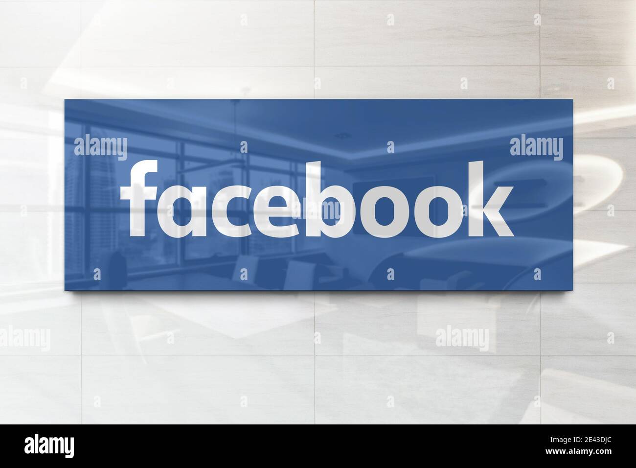 facebook logo on reflective business wall plaque Stock Photo - Alamy