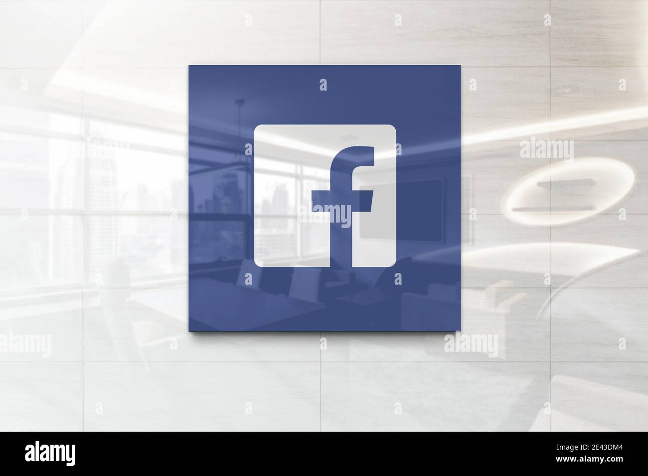 facebook logo on reflective business wall plaque Stock Photo - Alamy