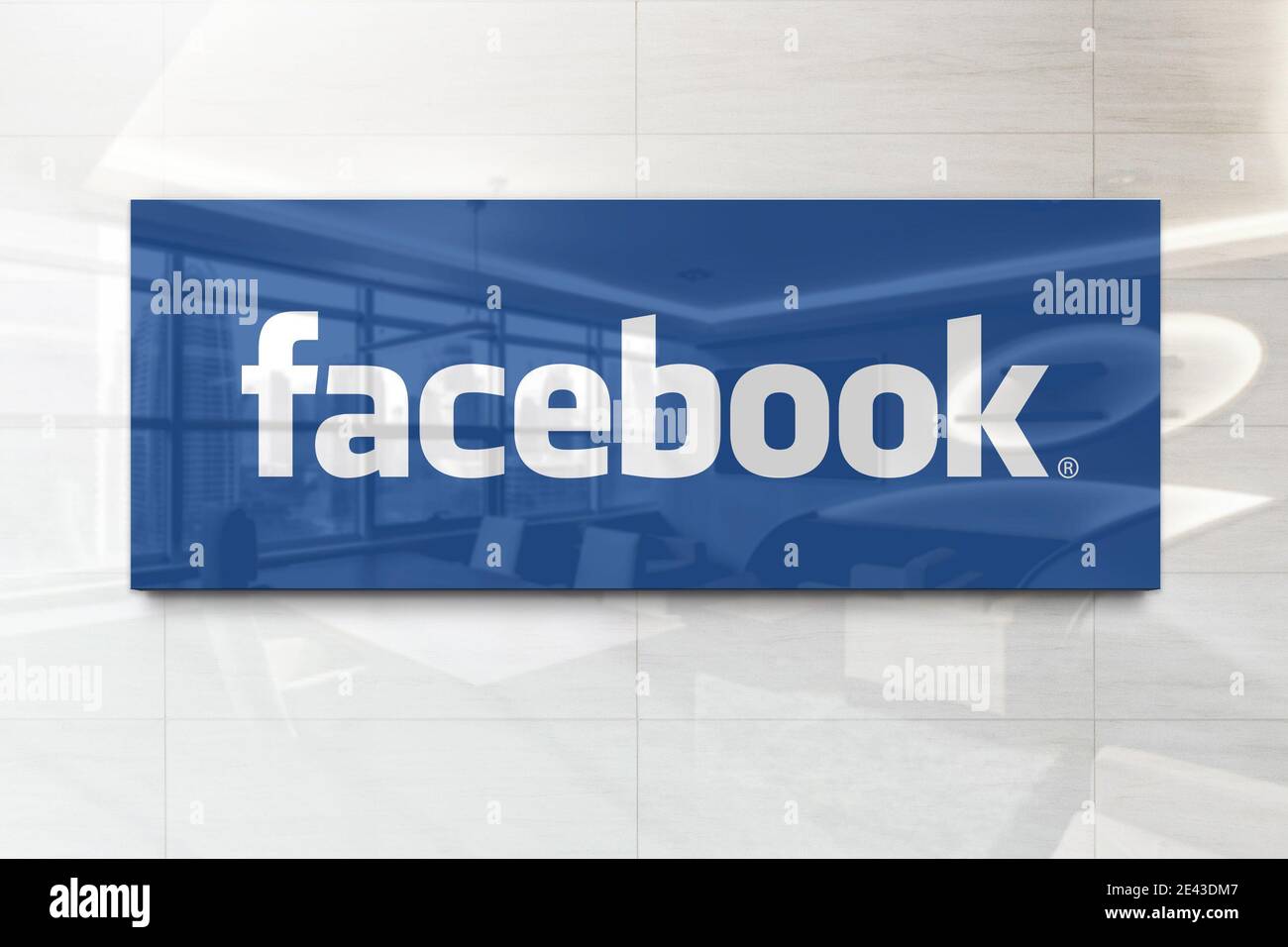 facebook logo on reflective business wall plaque Stock Photo - Alamy